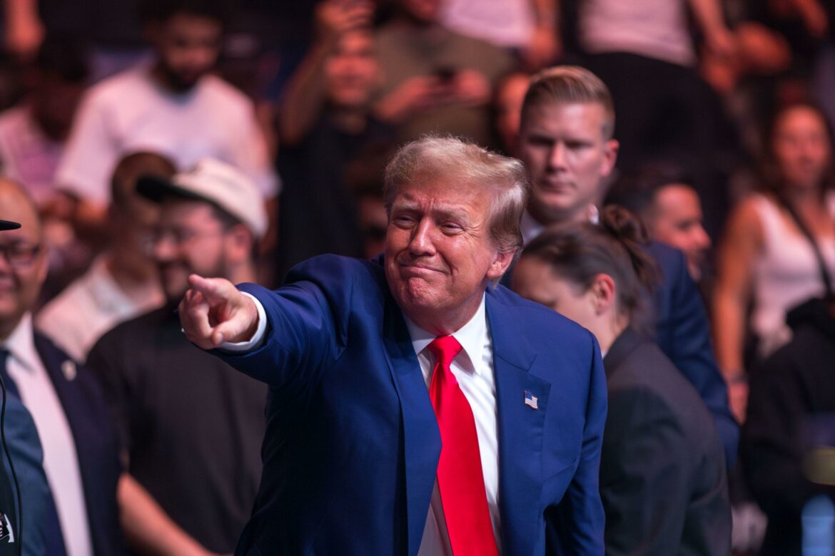 Trump arrives at NCAA wrestling championship to thunderous applause